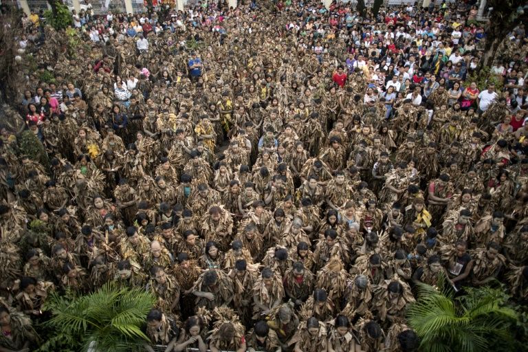 Quite a mud-dle! Filipino devotees slather themselves in mud for annual ...