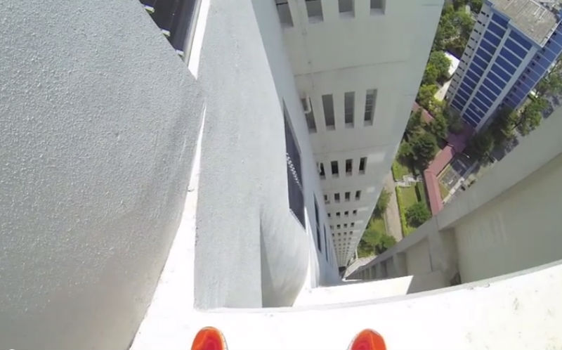 Video: Aspiring stuntman does handstand on apartment block ledge 24 ...